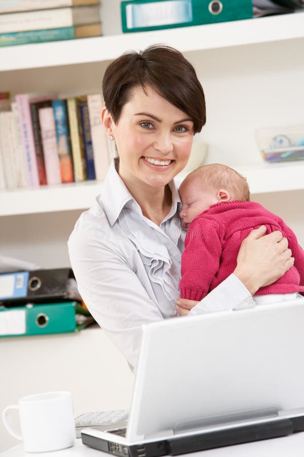 Man with Baby Working from Home Using Laptop Stock Image - Image of ...