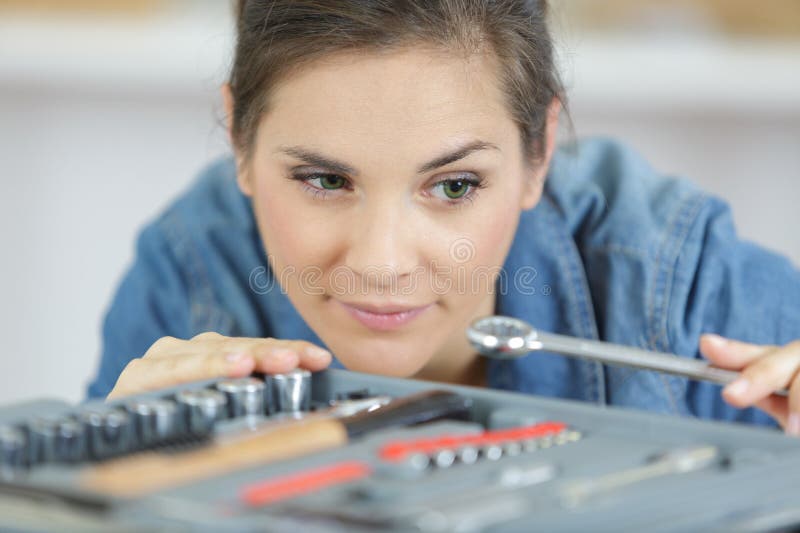 Woman next to tool box stock photo. Image of collection - 276073638