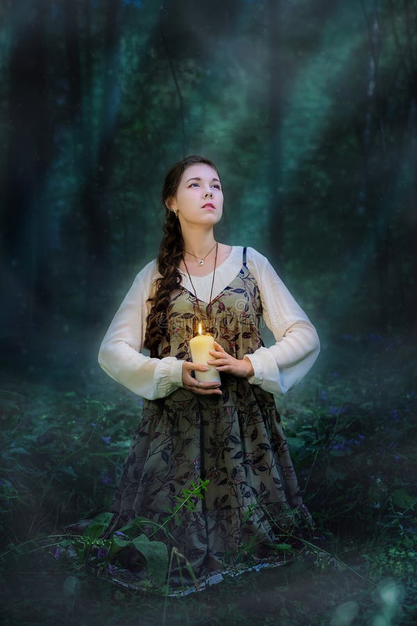 Woman at Night in the Forest Performs a Mysterious Ritual Stock Image ...