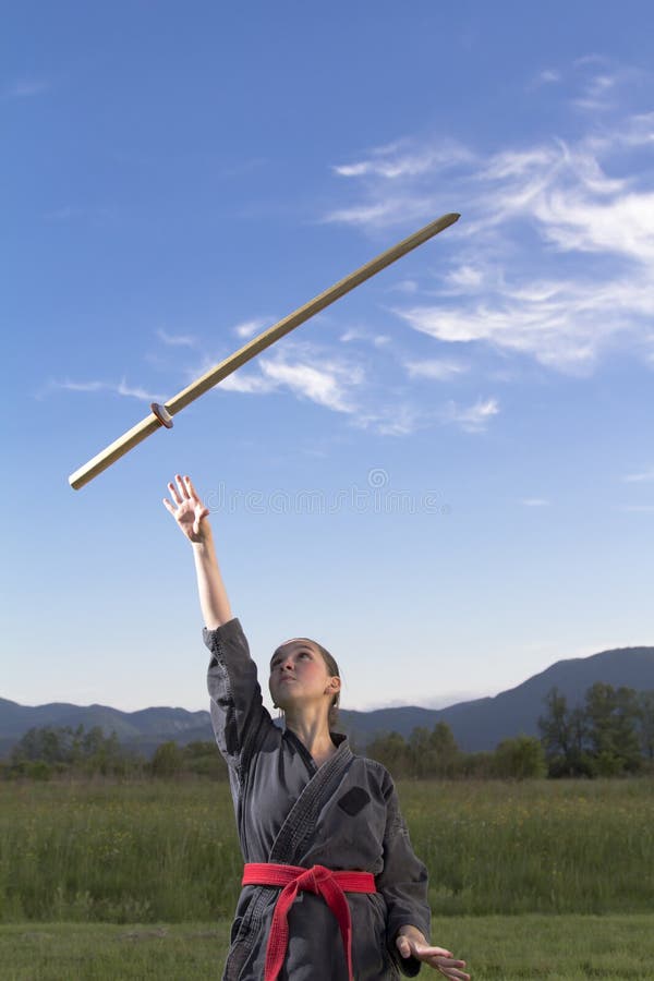 Woman ninja throwing sword stock photo. Image of agility - 24879606