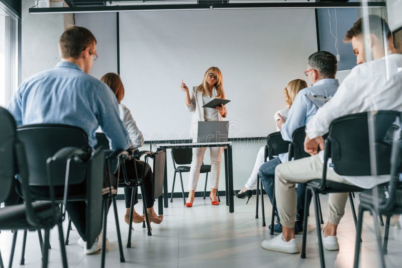 Woman with Notepad in Hands Doing Master Class. Group of Professional ...