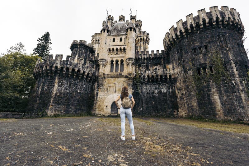 Woman Observing a Castle Aged by the Passage of Time Stock Image ...