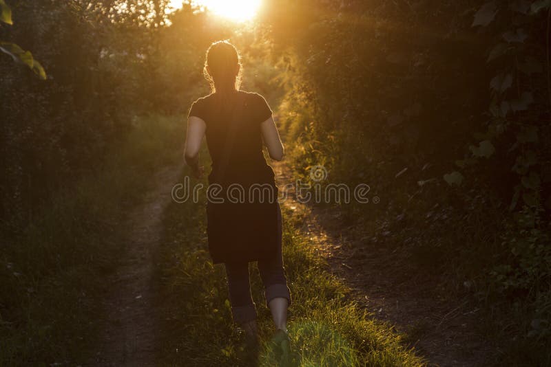 Woman Off Road Running at Sunset Stock Photo - Image of bright ...