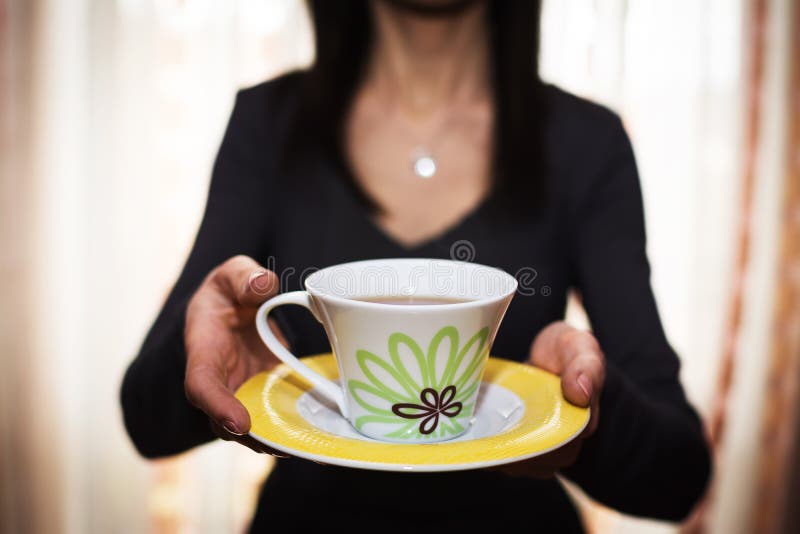 Woman Offering a Cup of Tea Blurring Stock Image - Image of female ...