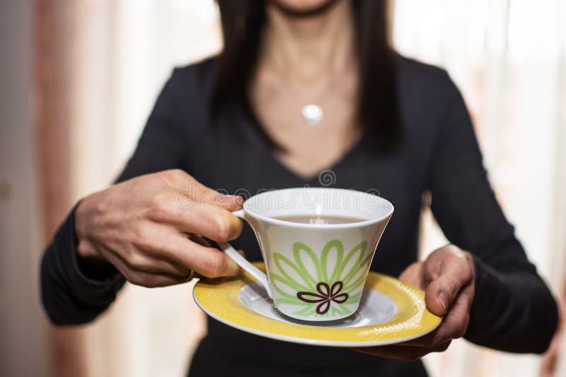 Woman Offering a Cup of Tea Blurring Stock Photo - Image of person ...