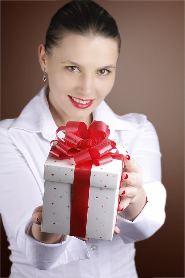 Woman offering a gift stock photo. Image of christmas - 6068458