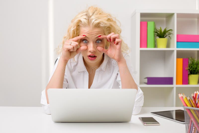 Woman in Office Looking at Computer and Holding Her Eyes Open Stock ...