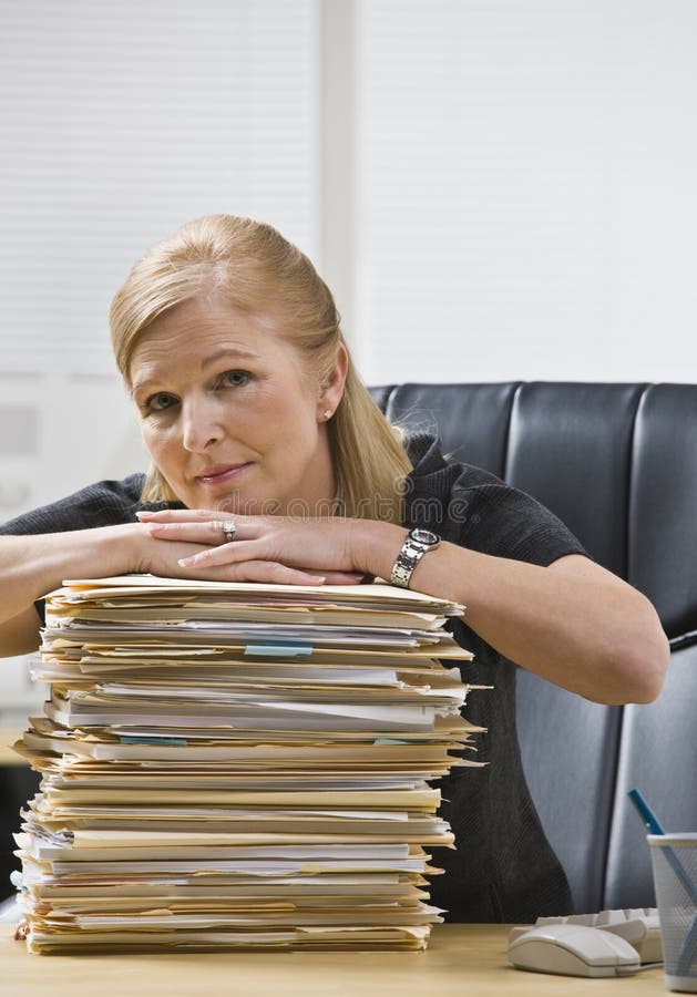 Woman Looking through Filing Cabinet Stock Image - Image of executive ...