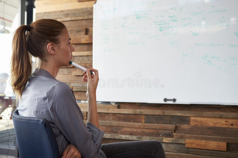 Woman in an Office Reading Notes on Whiteboard, Close Up Stock Image ...