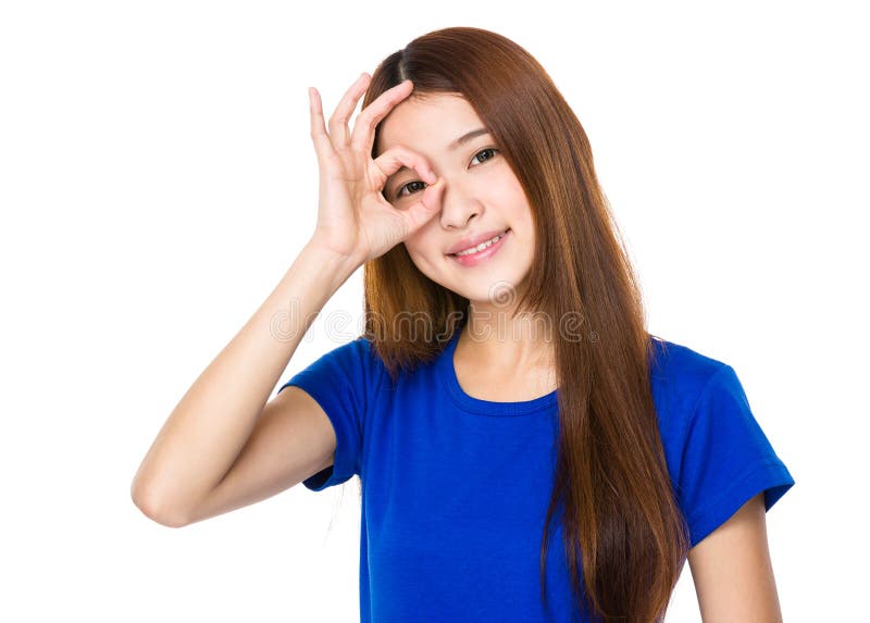 Woman with ok sign on eye stock image. Image of hand - 66015119