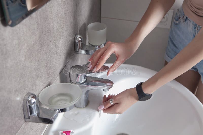 Woman Open a Faucet in the Bathroom Stock Photo - Image of morning ...