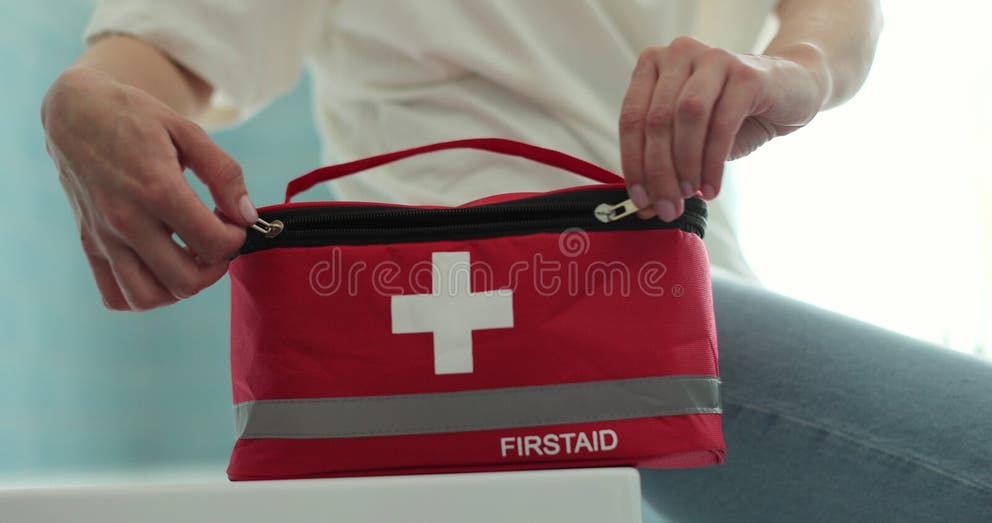 Woman Open the First Aid Kit at Home. First Aid Kit. Stock Image ...