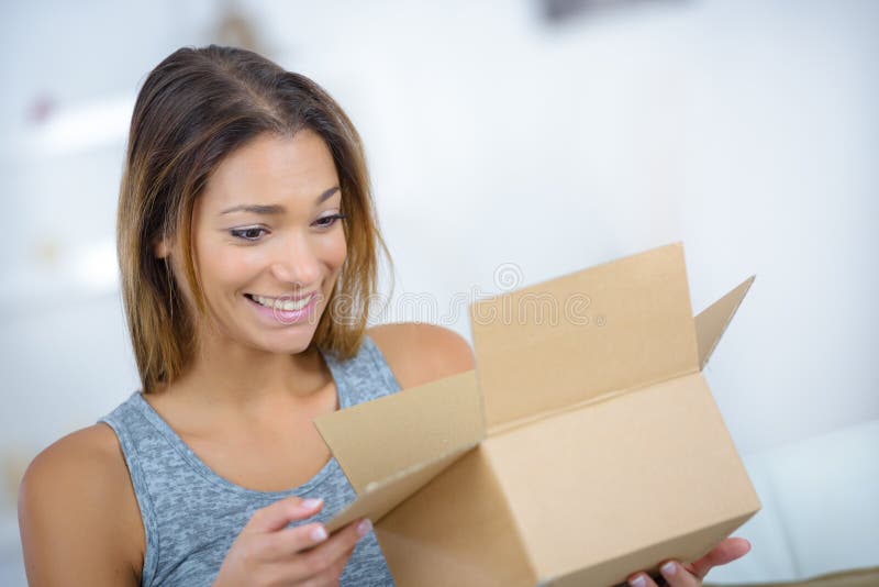 Woman opening box stock photo. Image of brics, opening - 281820976