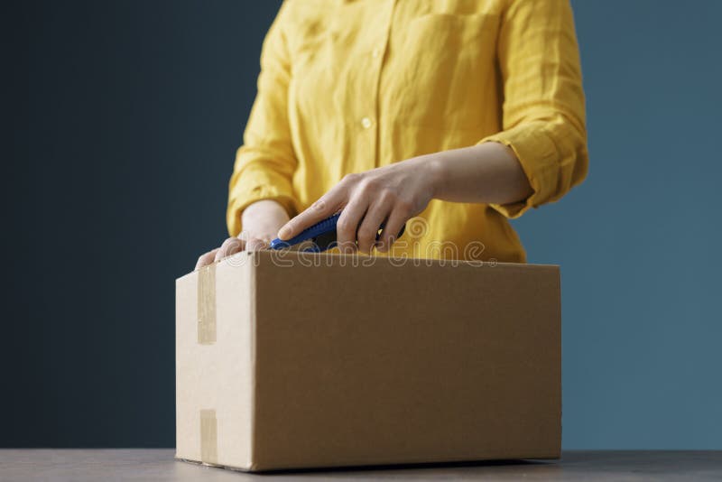 Woman Opening a Delivery Box Stock Image - Image of service, brown ...