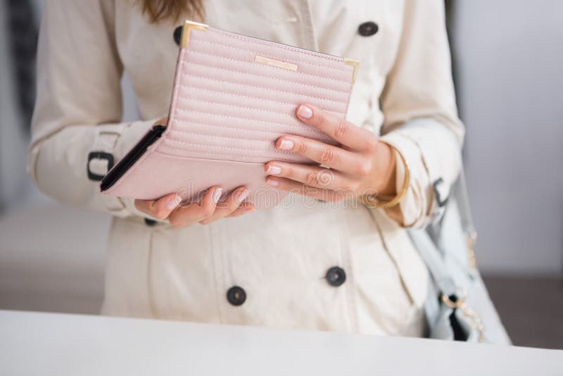 Woman opening her wallet stock photo. Image of wallet - 56493580