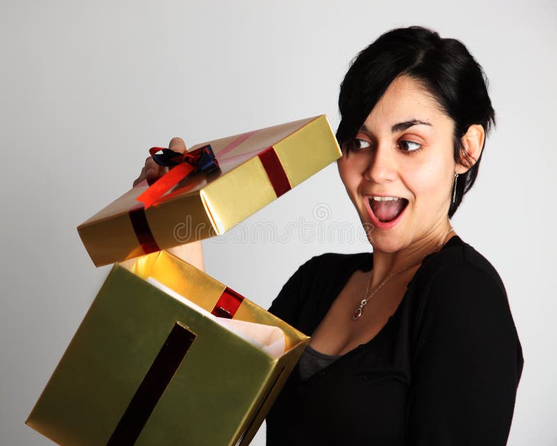 Woman opening a present stock image. Image of open, female - 27935181