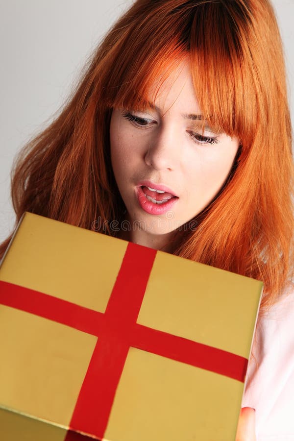Woman opening a present stock image. Image of happiness - 27935443