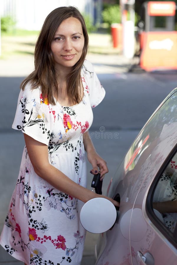 Woman opens the gas tank stock photo. Image of refill - 25146086