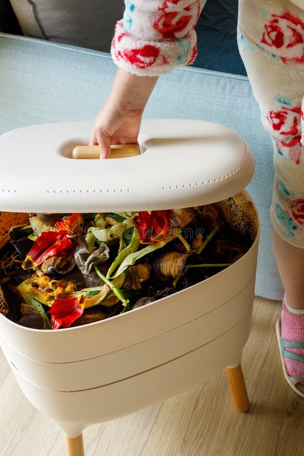 A Woman Opens a Home Composter, the Zero Waste Concept Stock Photo ...