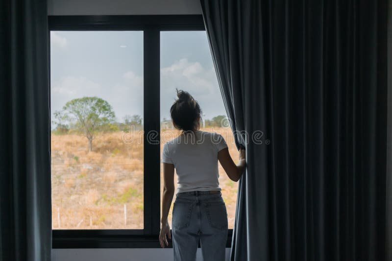 Woman Opens Windows Curtain of Bedroom and Checking the View. Stock ...