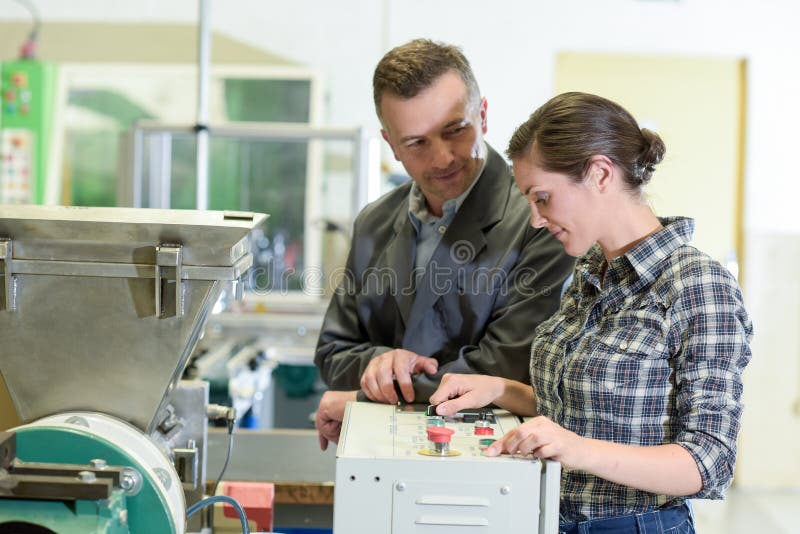 Woman Operating and Adjusting Machine Stock Photo - Image of machine ...