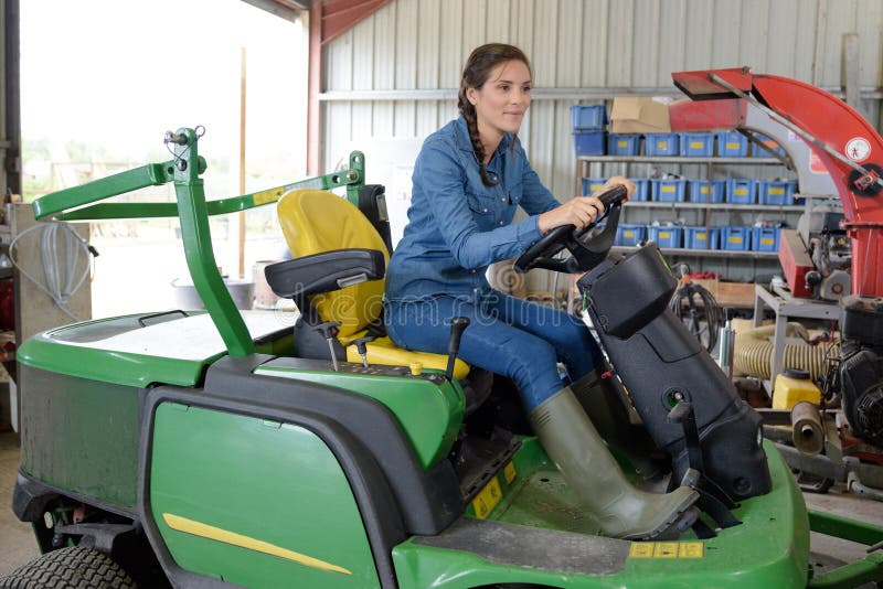 Woman operating tractor stock image. Image of manual - 173911691