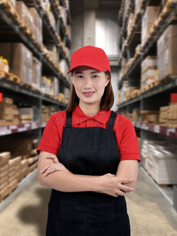 Woman Operator in Uniform with Blurred the Background of the Warehouse ...