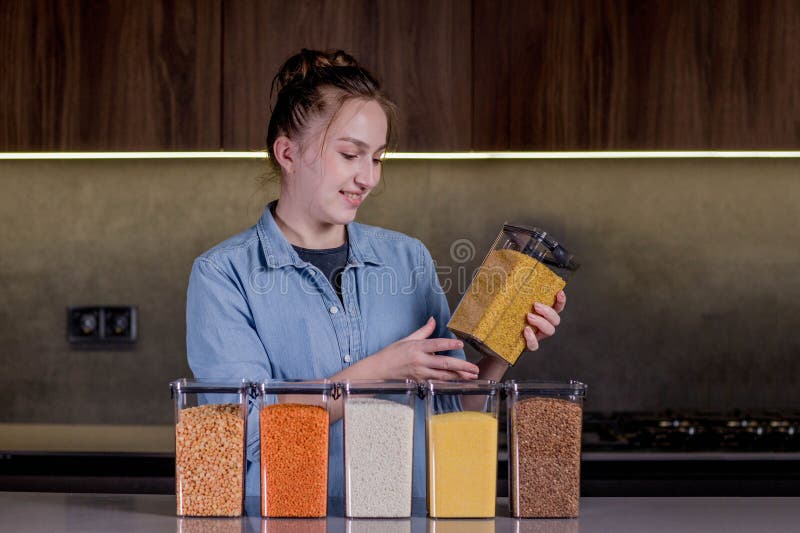Woman Organizing Food in the Kitchen with Containers Stock Image ...