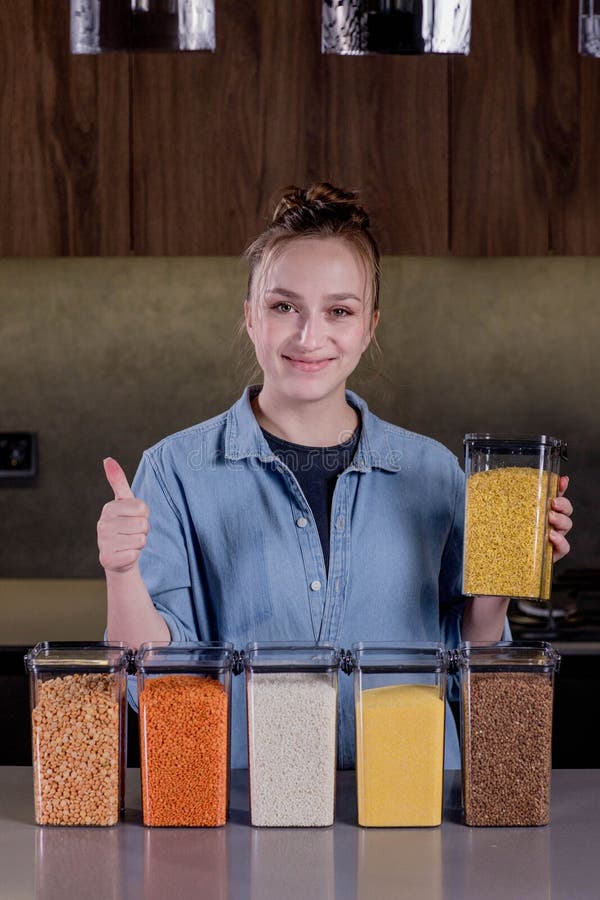 Woman Organizing Food in the Kitchen with Containers Stock Image ...