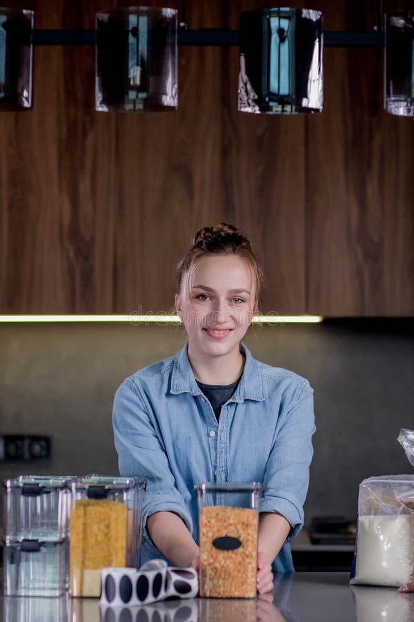 Woman Organizing Food in the Kitchen with Containers Stock Image ...