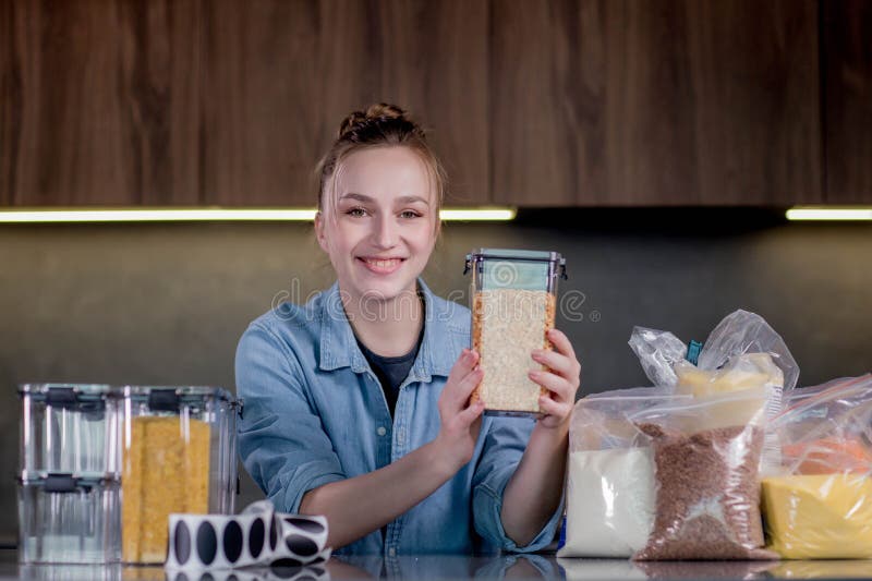 Woman Organizing Food in the Kitchen with Containers Stock Image ...