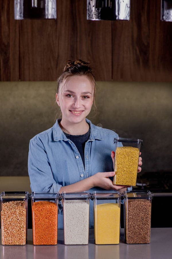 Woman Organizing Food in the Kitchen with Containers Stock Image ...