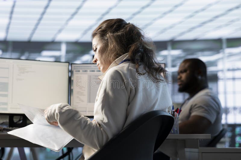 Woman Overseeing Server Room Reading Documentation Paperwork Stock ...