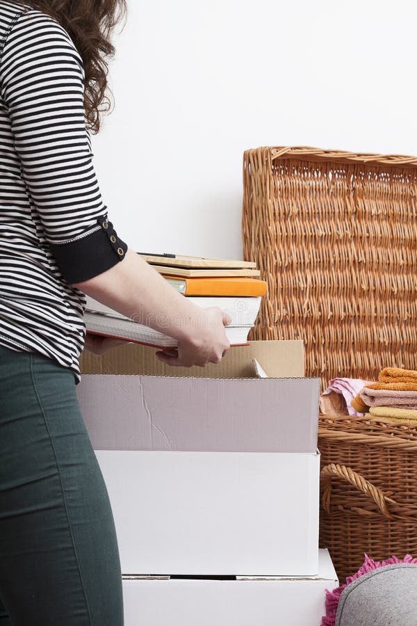 Woman packing books stock image. Image of moving, decoration - 38417141