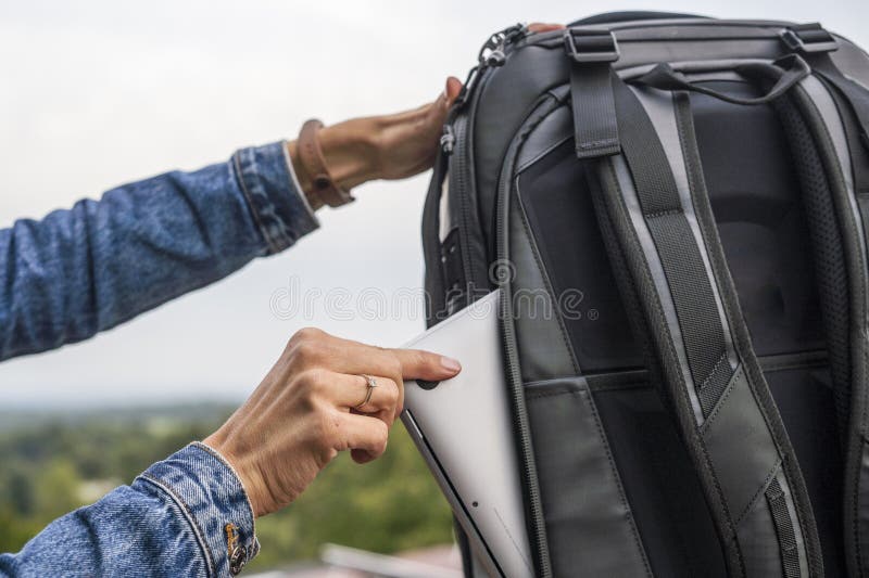 Woman Packing a Laptop in Backpack Stock Photo - Image of travel ...