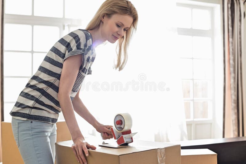Woman Packing Moving Box at Home Stock Image - Image of casual ...