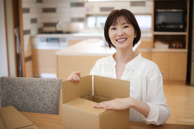 Woman packing work stock photo. Image of indoors, person - 242526734