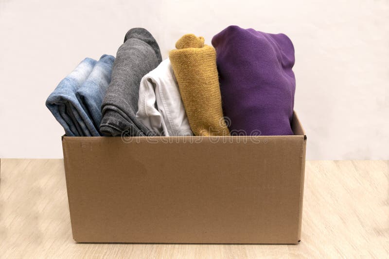 Woman Packs Clothes in Boxes for Donating. Stock Image - Image of items ...