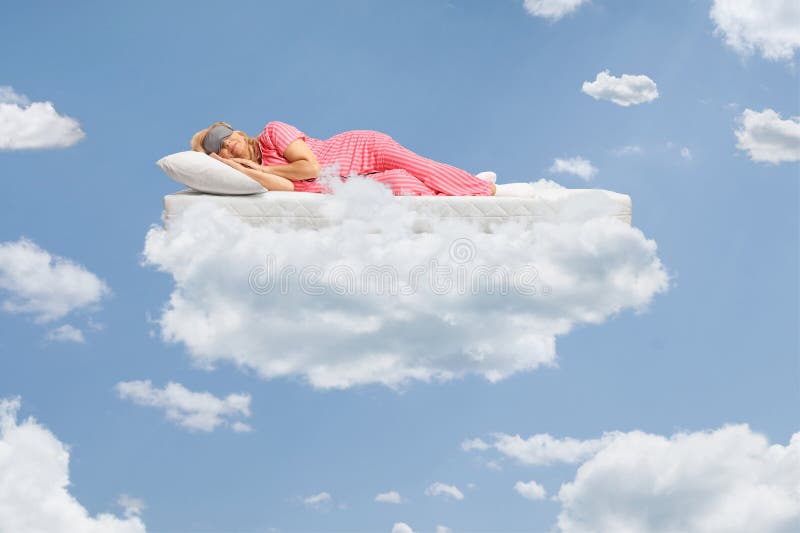Woman in Pajamas Sleeping on a Mattress and Floating on a Cloud Stock ...