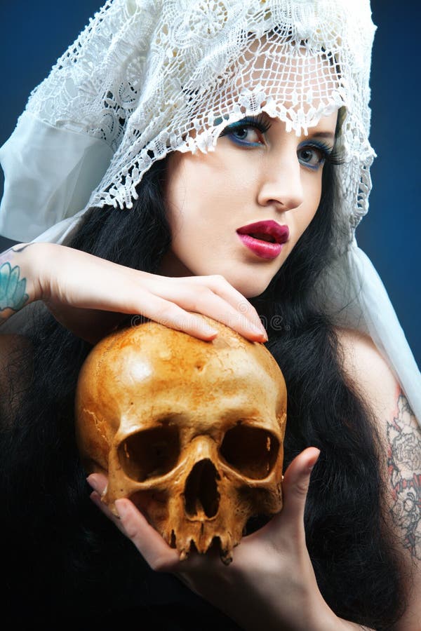Woman with a Pale Face and Skull. Stock Photo - Image of cranium, hand ...