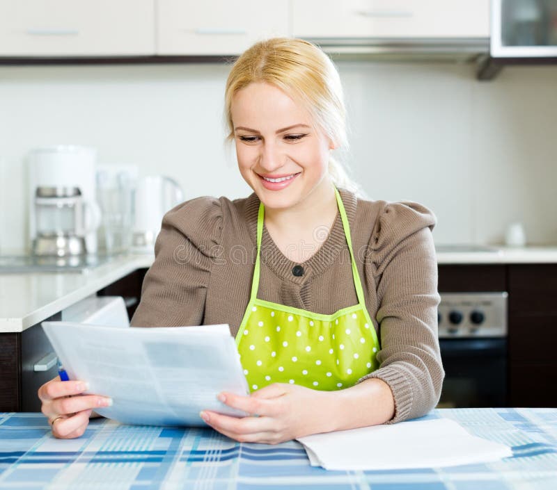Woman with paper at home stock photo. Image of reading - 51206072