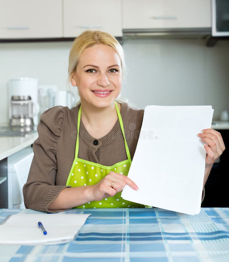 Woman with paper at home stock photo. Image of financial - 74637046