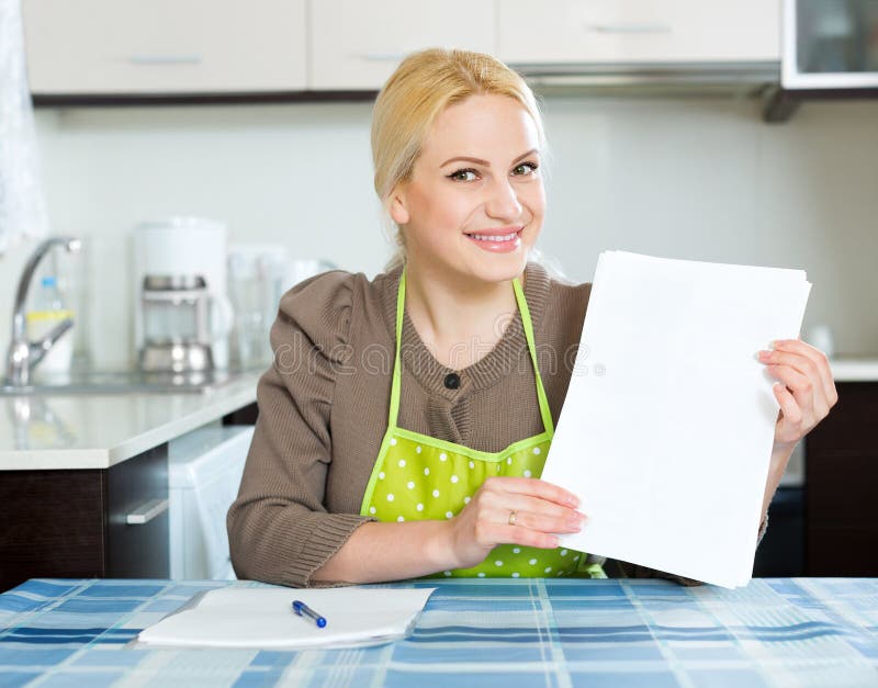 Woman with paper at home stock image. Image of business - 61393937