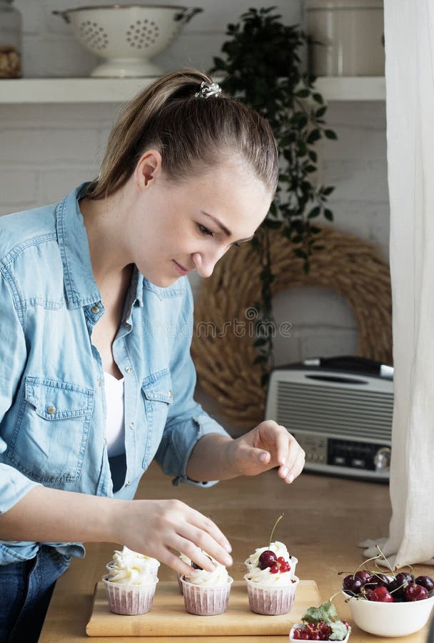 Young Woman Pastry Chef Decorates Cupcakes Stock Image - Image of baker ...