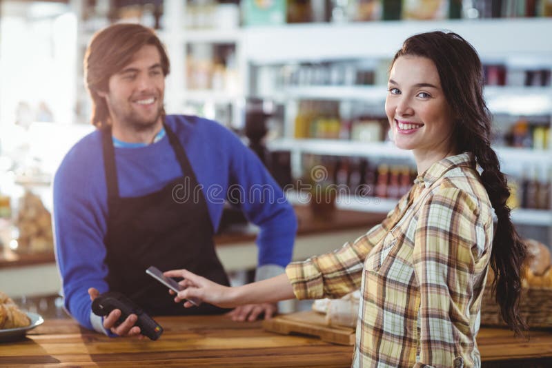 Woman Paying Bill through Smartphone Using NFC Technology Stock Image ...