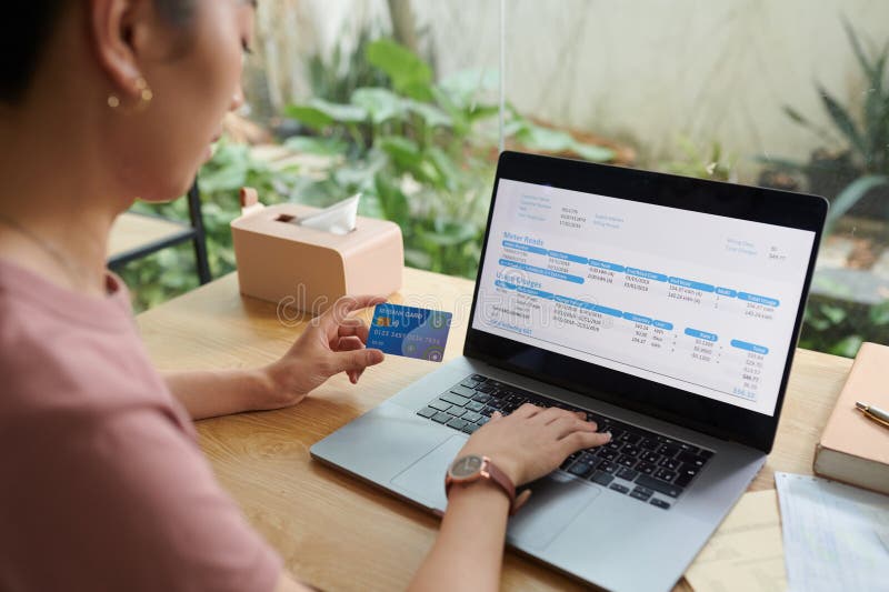 Woman Paying Utility Bills stock photo. Image of bill - 310951288