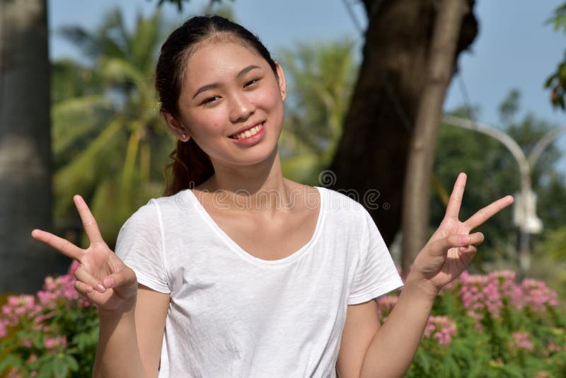 Woman and Peace Sign stock photo. Image of pretty, sign - 130655950