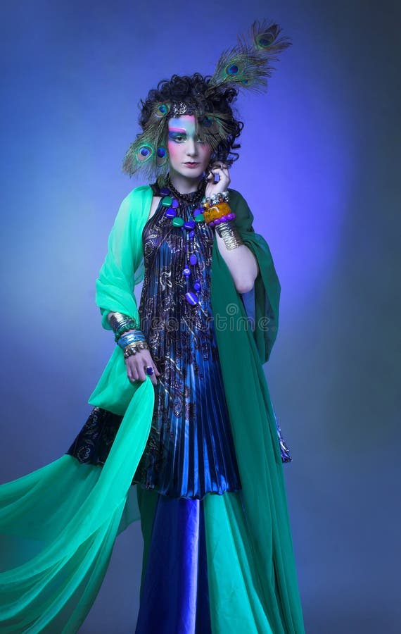 Woman in peacock image. stock photo. Image of green, color - 32405604