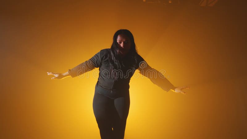 Dynamic Dance Performance Against Yellow Background Stock Footage ...