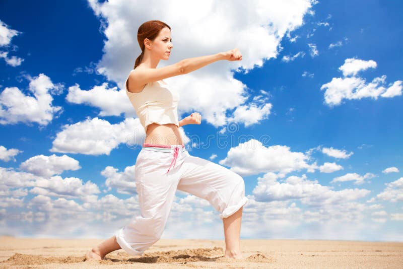 Woman performing a kick stock image. Image of outdoors - 31331645